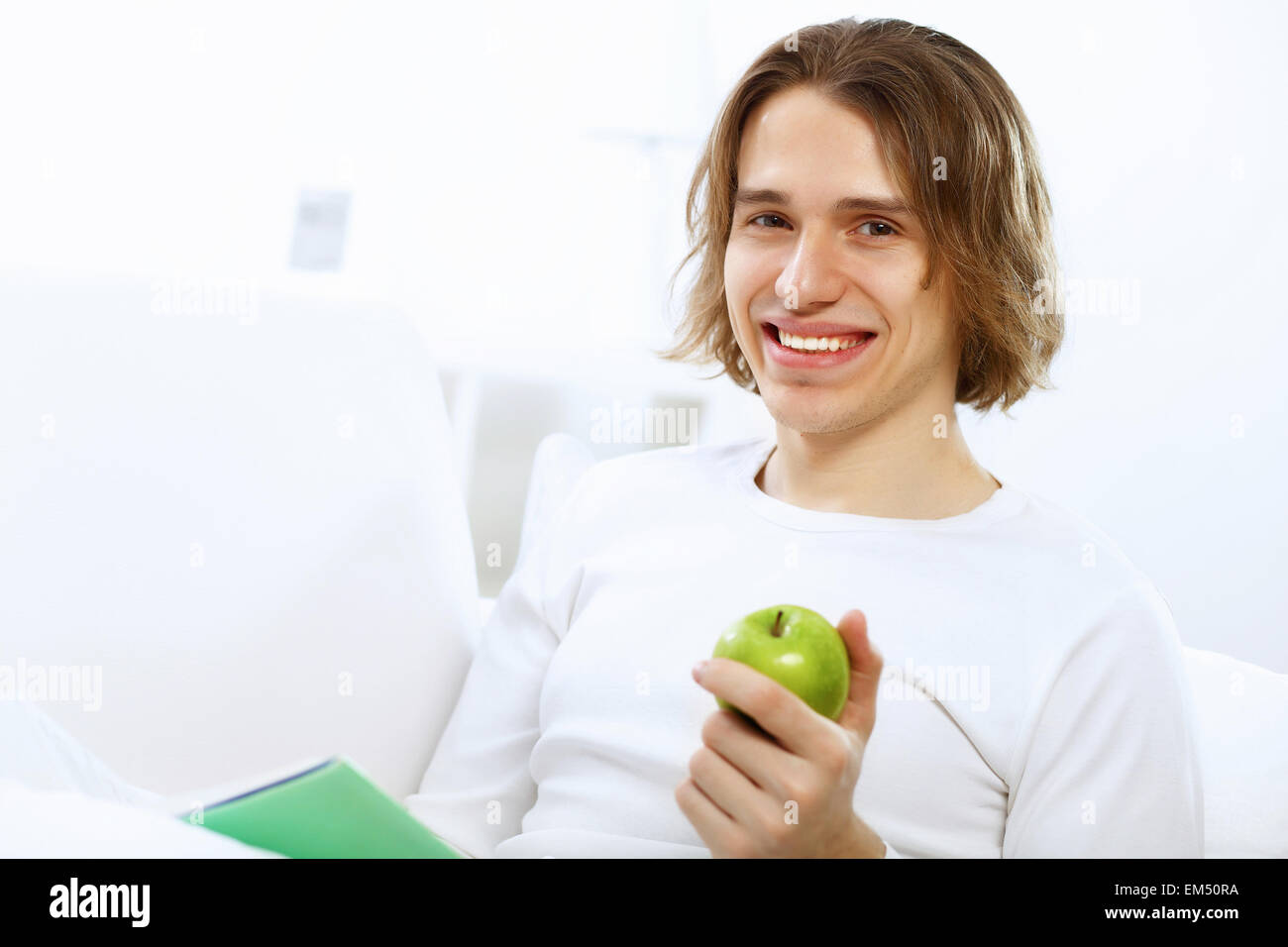 Young man with notebook Stock Photo - Alamy