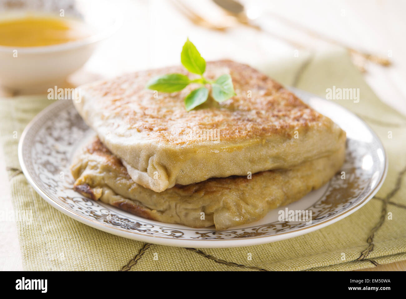 Mutabbaq or Murtabak is a stuffed Arabic bread Stock Photo - Alamy