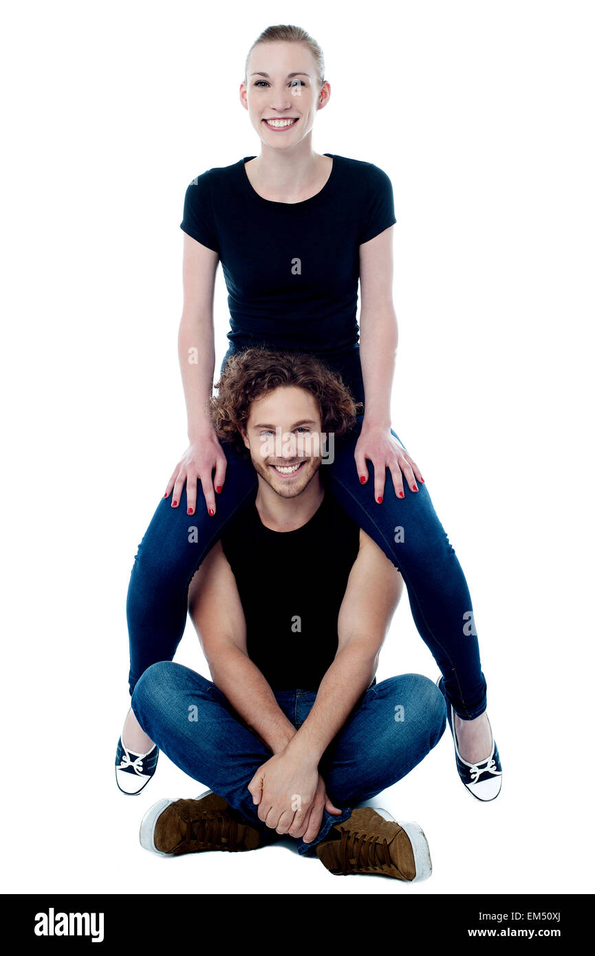 Girl sitting on boyfriend's shoulders Stock Photo - Alamy