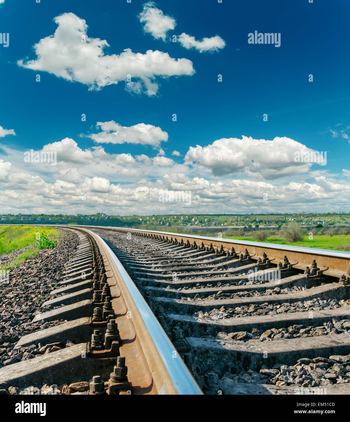 railroad closeup to horizon and deep blue sky with clouds Stock Photo ...