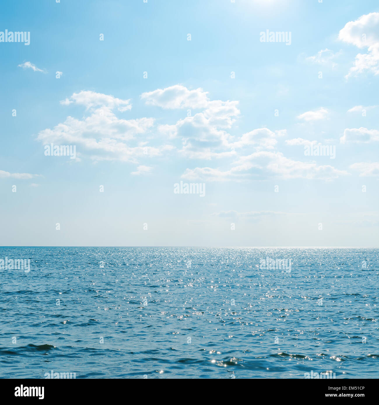 blue sea and clouds over it Stock Photo - Alamy