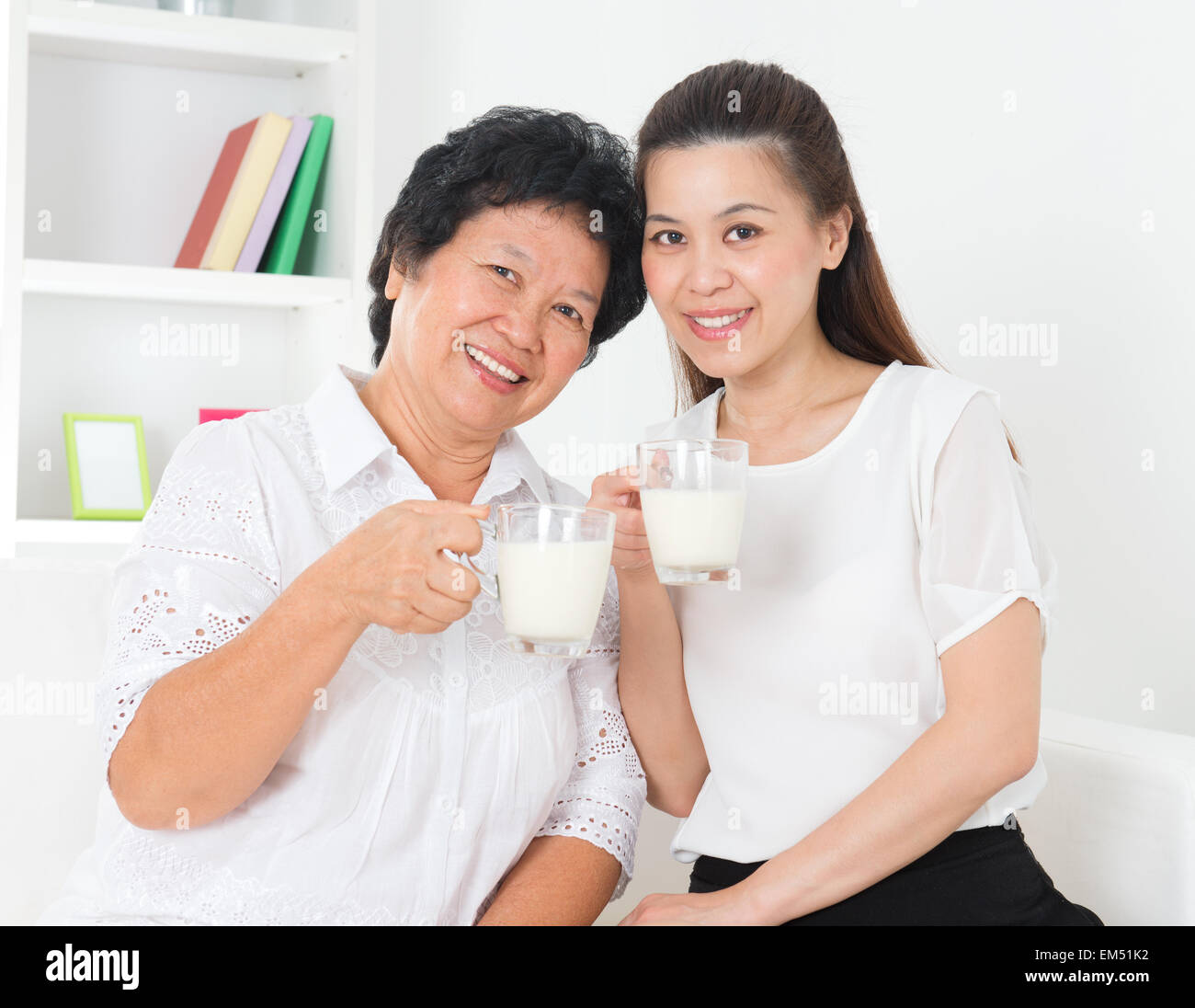 Women drinking milk Stock Photo - Alamy