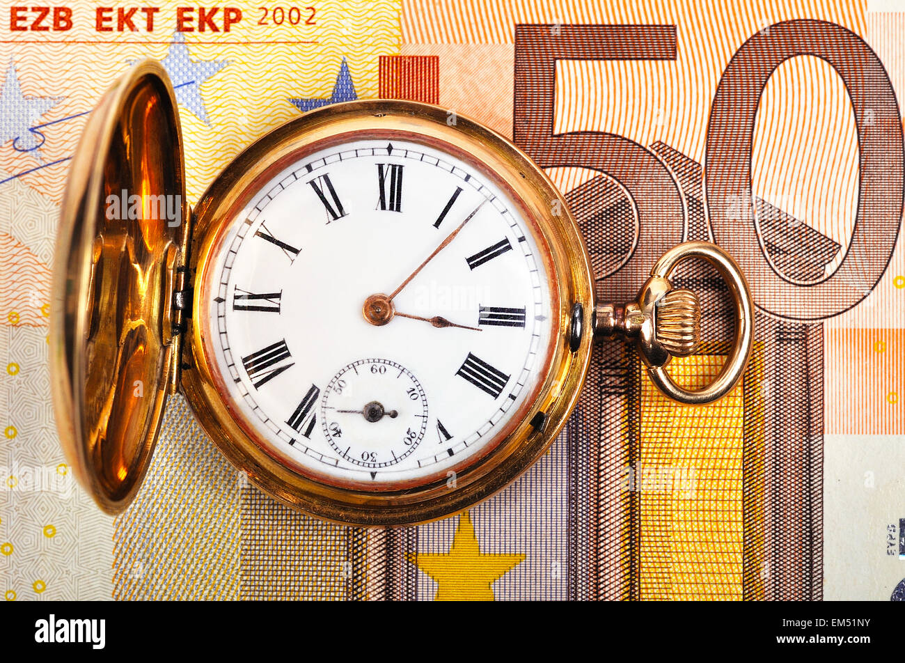 gold pocket watch and euro bills, close up Stock Photo - Alamy
