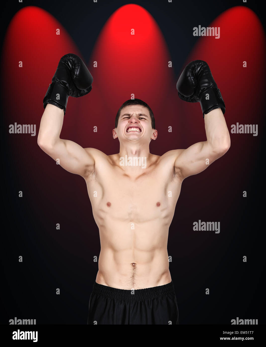 boxer winner under the rays of spotlight Stock Photo - Alamy