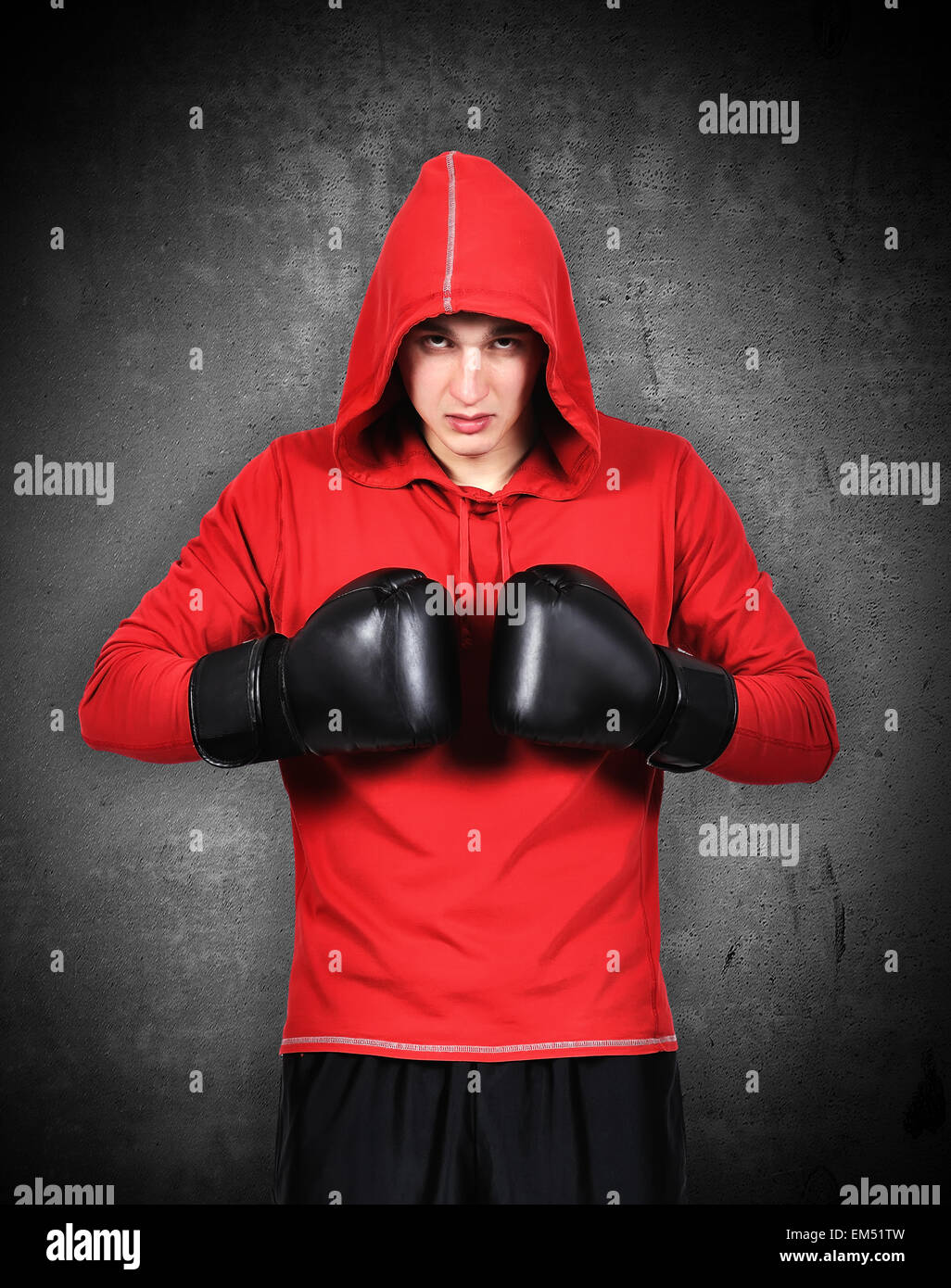 young muscular man wearing boxing black gloves Stock Photo - Alamy