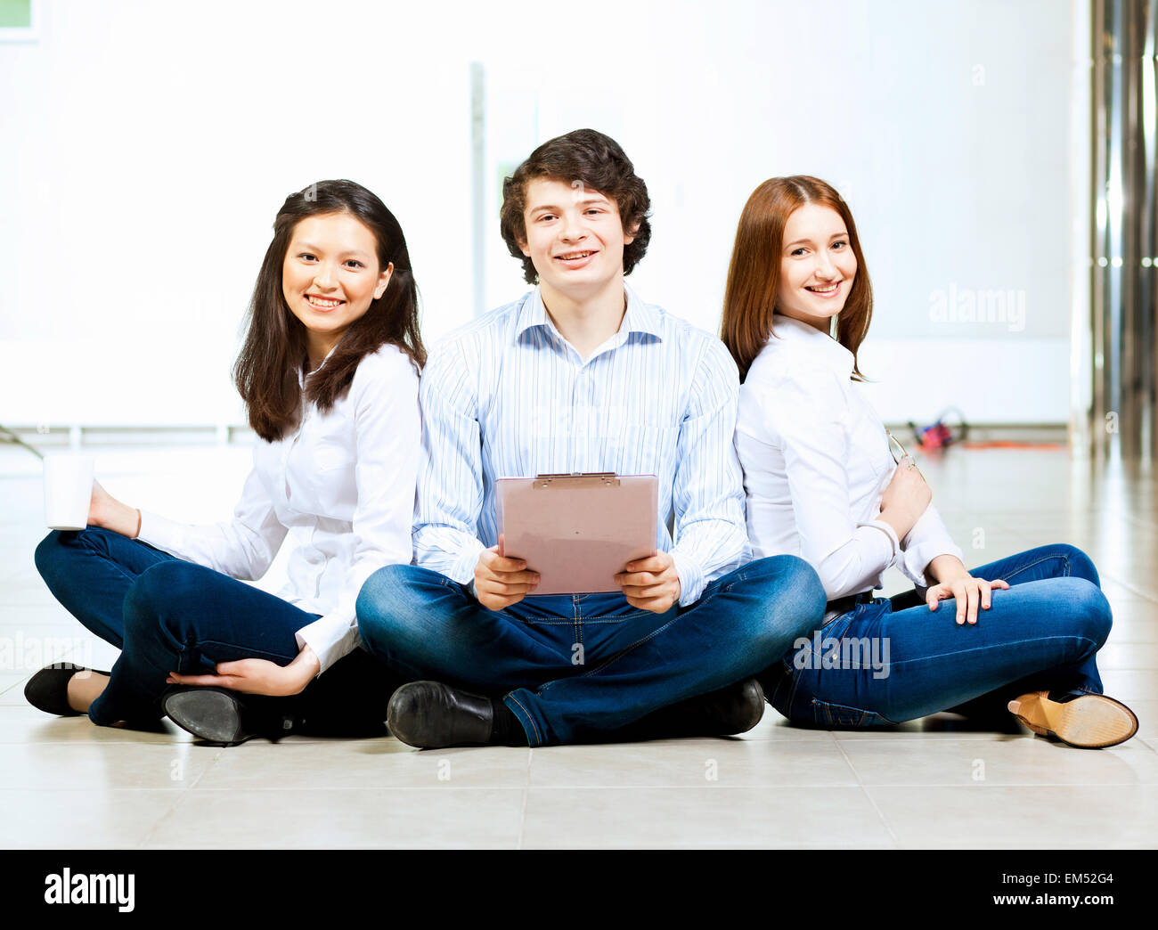 Three students smiling Stock Photo - Alamy