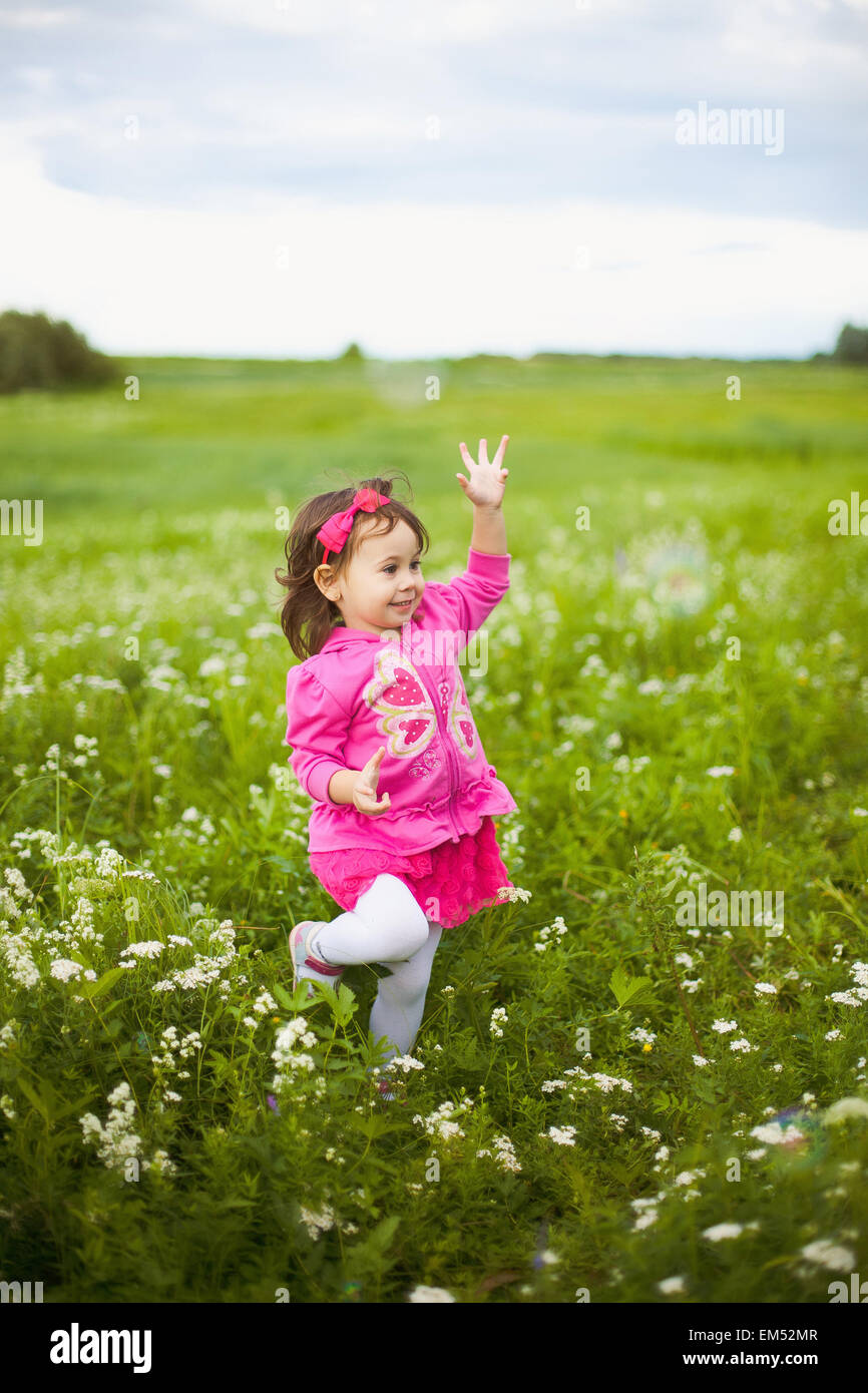 Child running away grass hi-res stock photography and images - Alamy