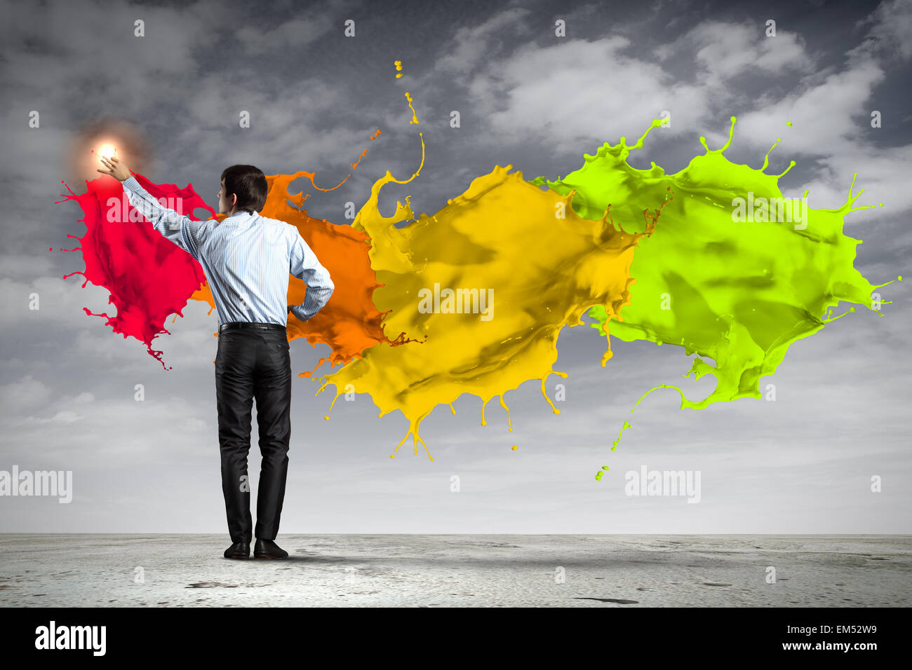 Man painting splashes Stock Photo - Alamy