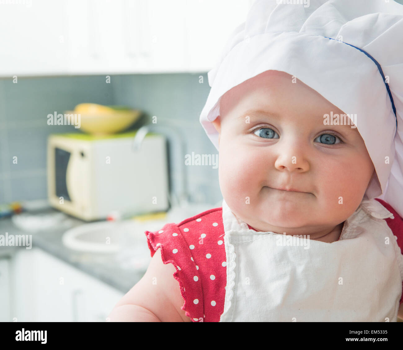 little baby in a chef's hat Stock Photo - Alamy