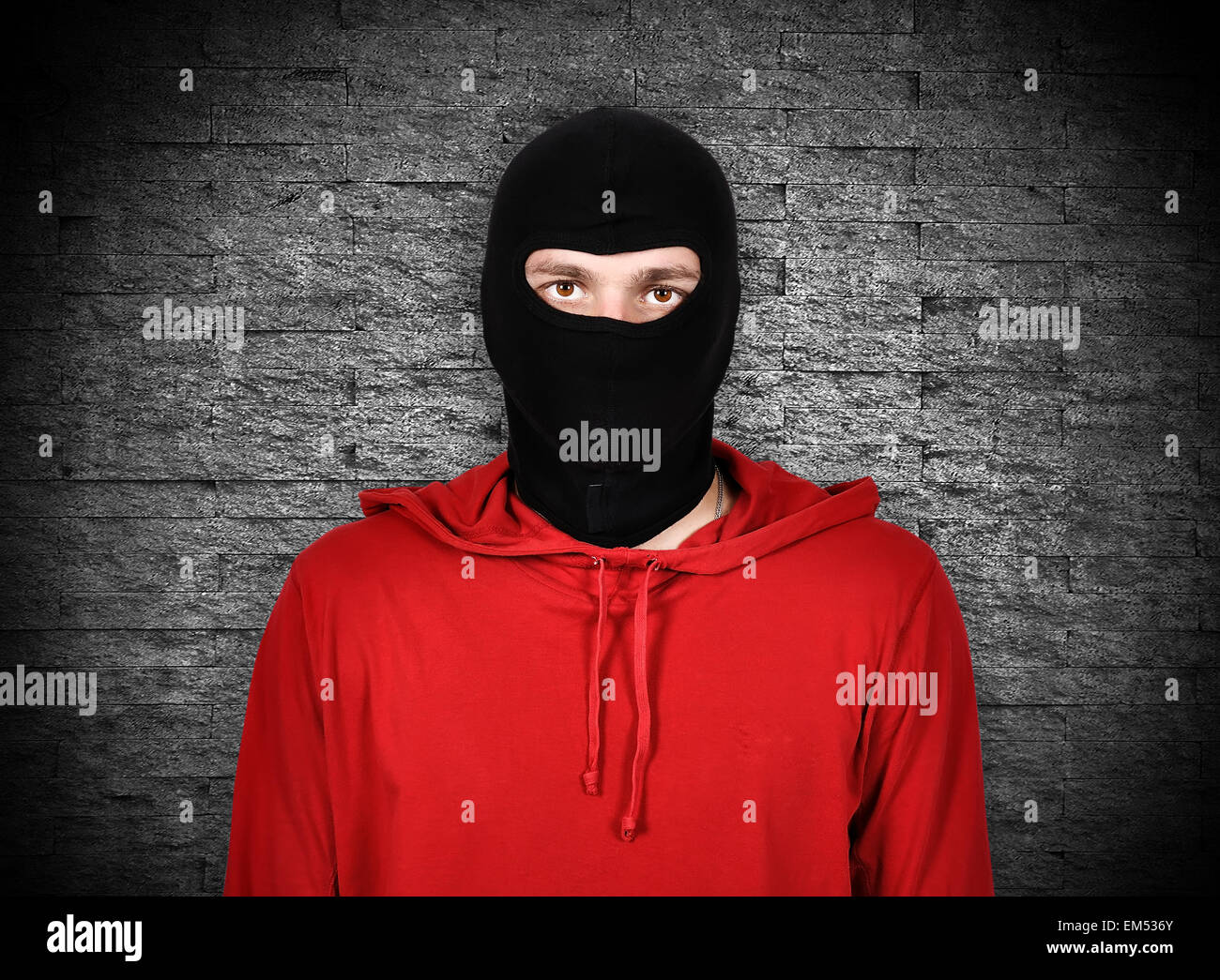 robber with red hoodie and black glasses Stock Photo - Alamy