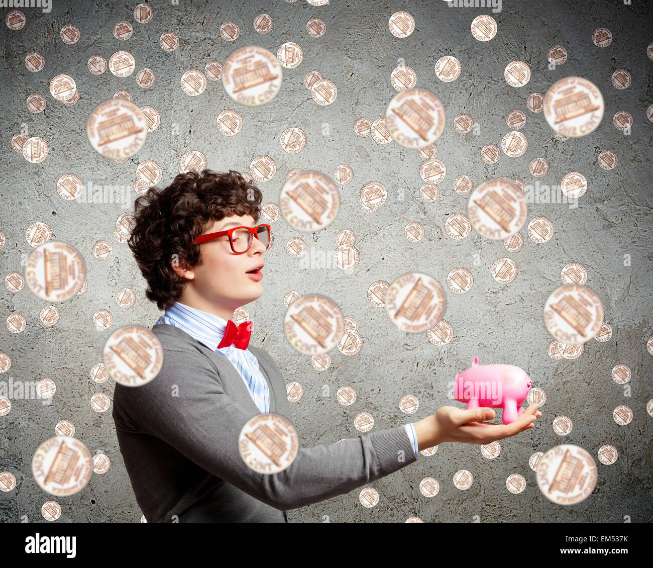 Young businessman holding moneybox Stock Photo - Alamy