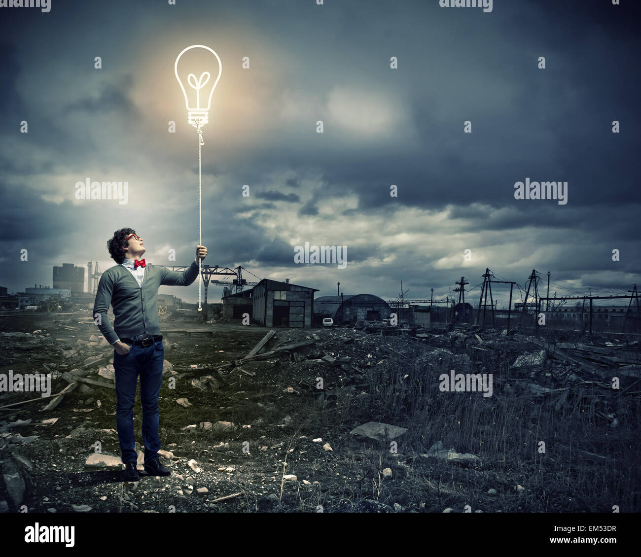 Young man holding a light Stock Photo - Alamy