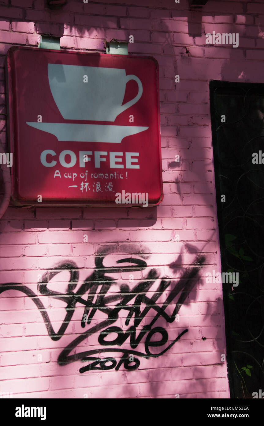 China, Beijing, Sign for coffee and painted graffiti in 798 Art Zone ...