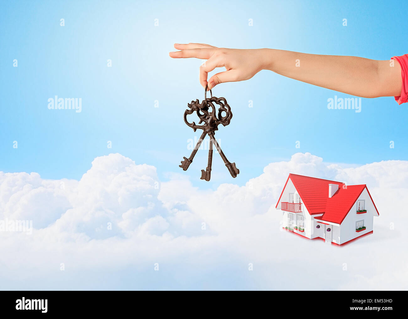 Hand holding keys Stock Photo - Alamy