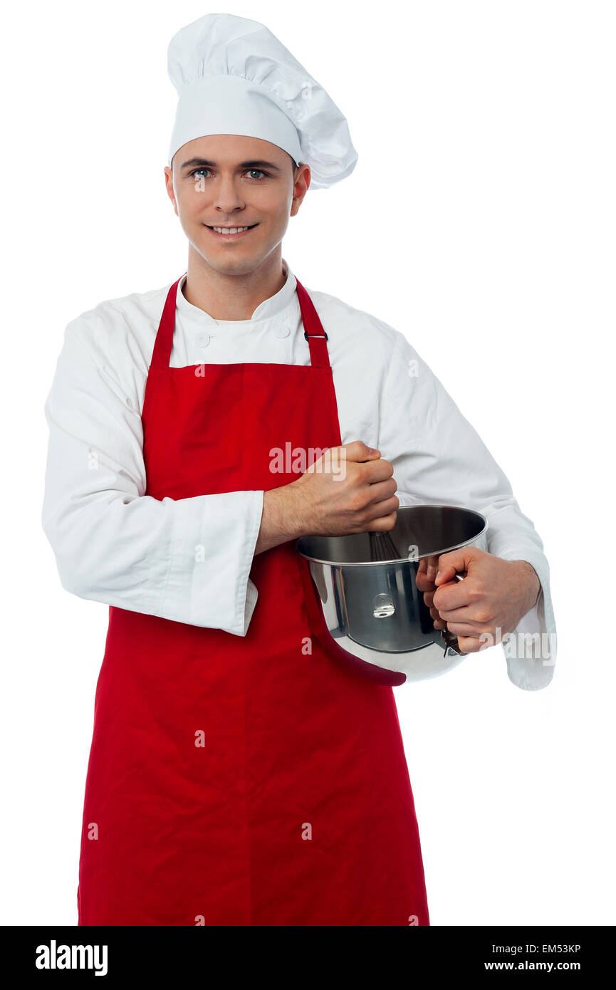 Smiling confident chef holding vessel Stock Photo - Alamy