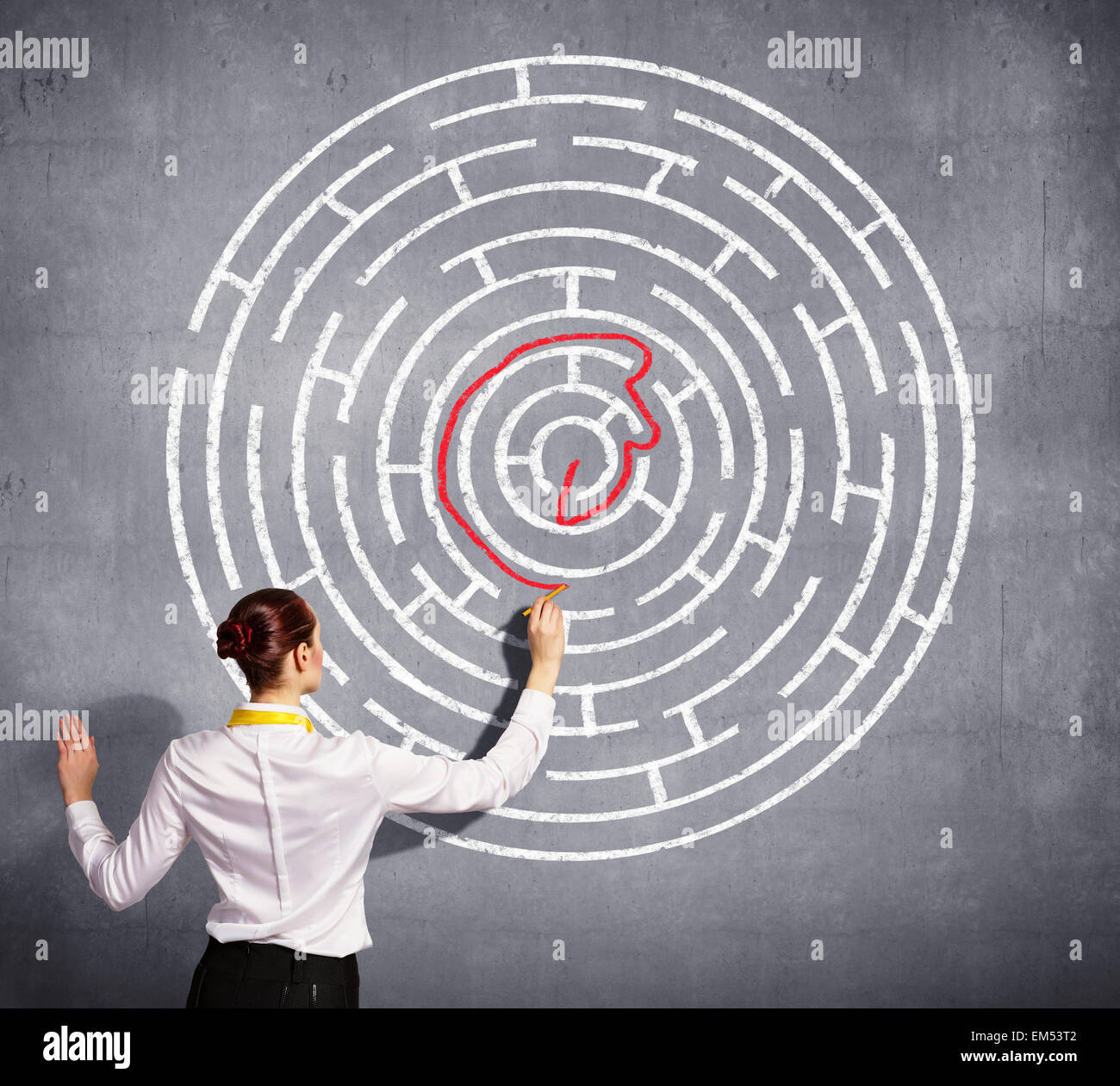 Businesswoman solving maze problem Stock Photo - Alamy