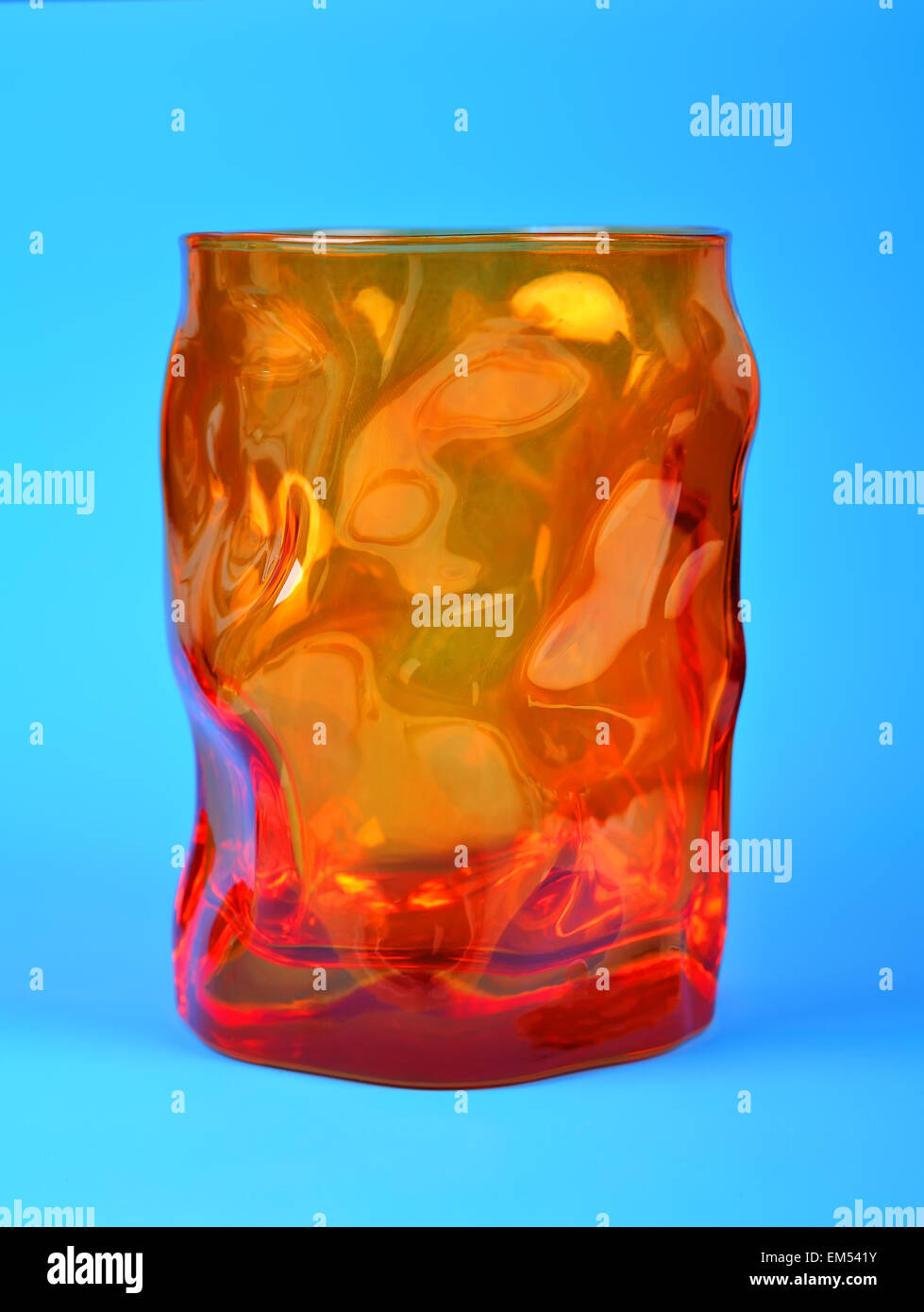 crumpled glass on a blue background Stock Photo - Alamy