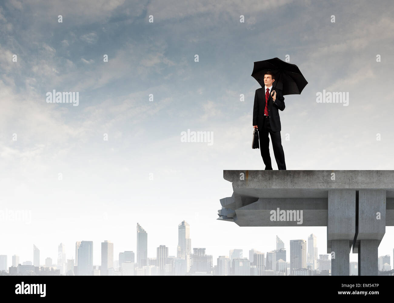 Businessman standing on bridge Stock Photo - Alamy