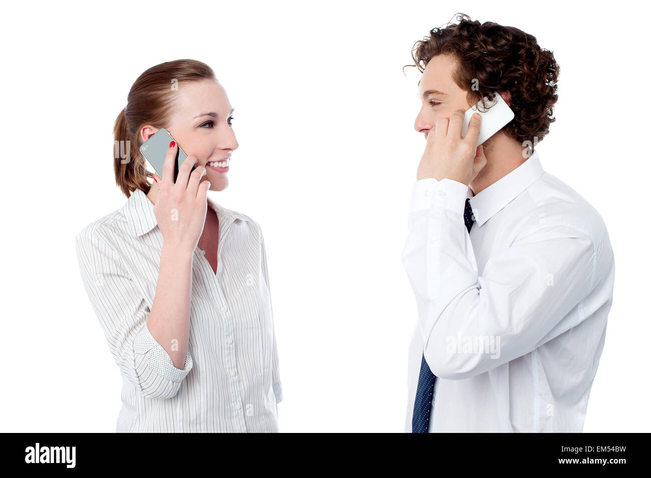 Office executives engaged over a phone call Stock Photo - Alamy