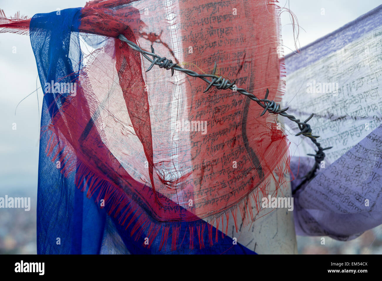Close-up of prayer flags and barb wires. Perfect image to symbolise ...