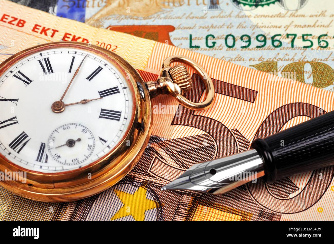 gold watch, ink pen and euro bills, close up Stock Photo - Alamy