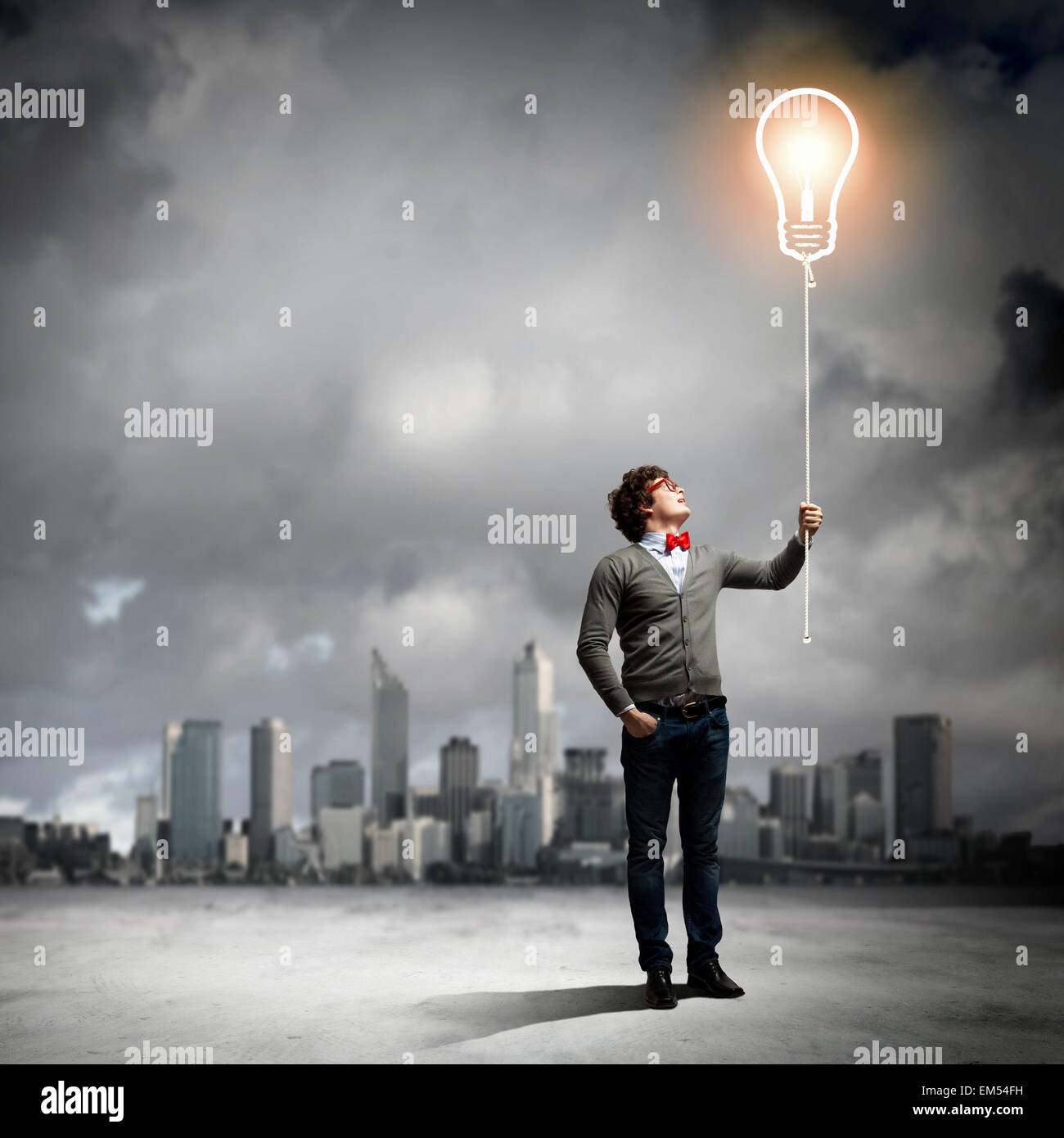 Young man holding a light Stock Photo - Alamy