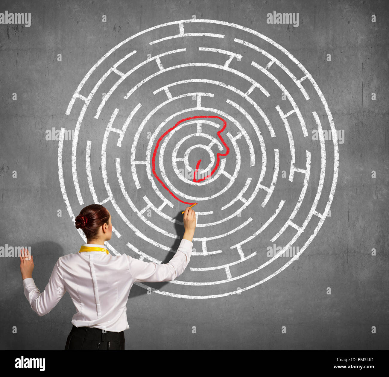 Businesswoman solving maze problem Stock Photo - Alamy