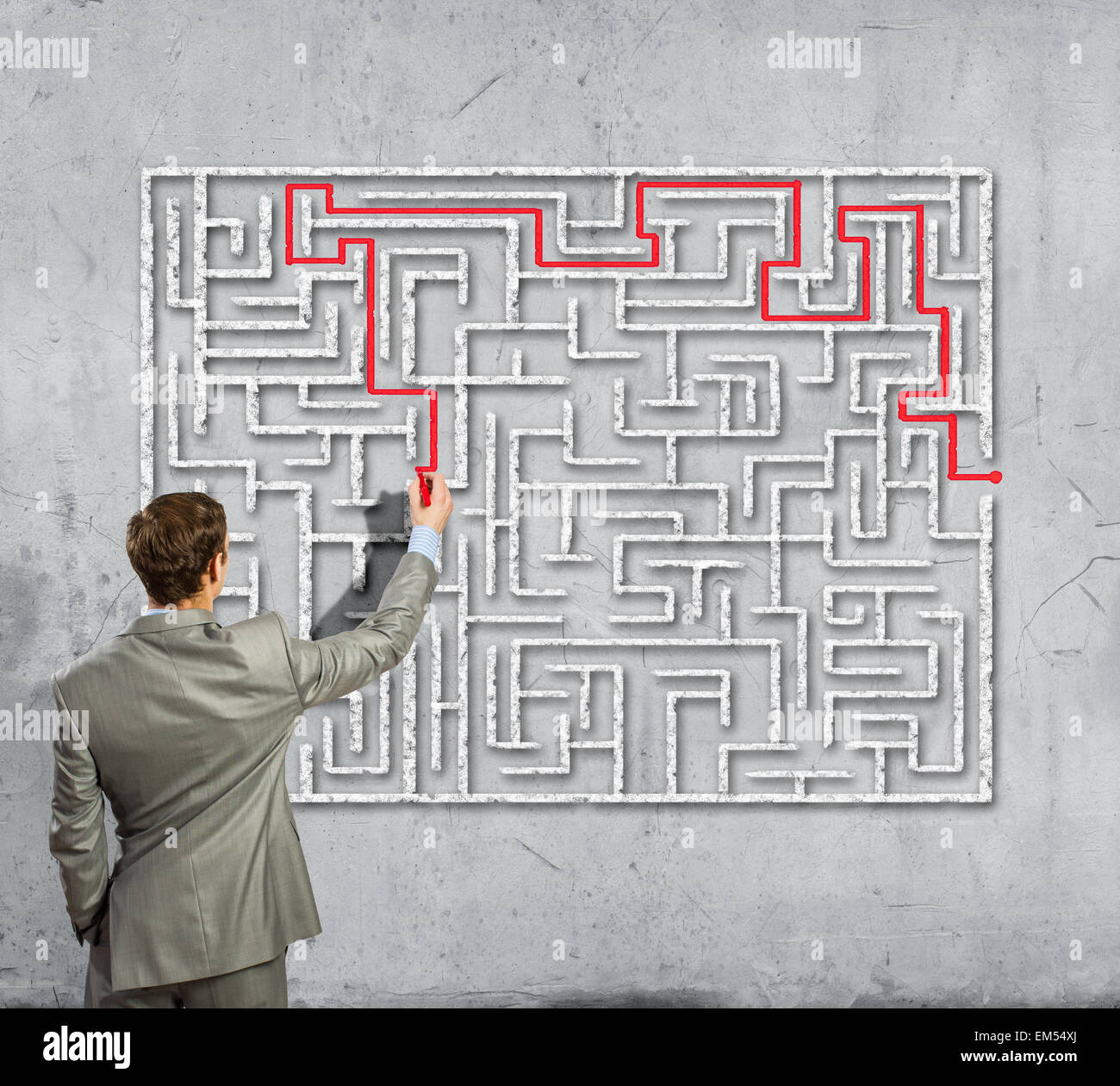 Businessman solving labyrinth problem Stock Photo - Alamy