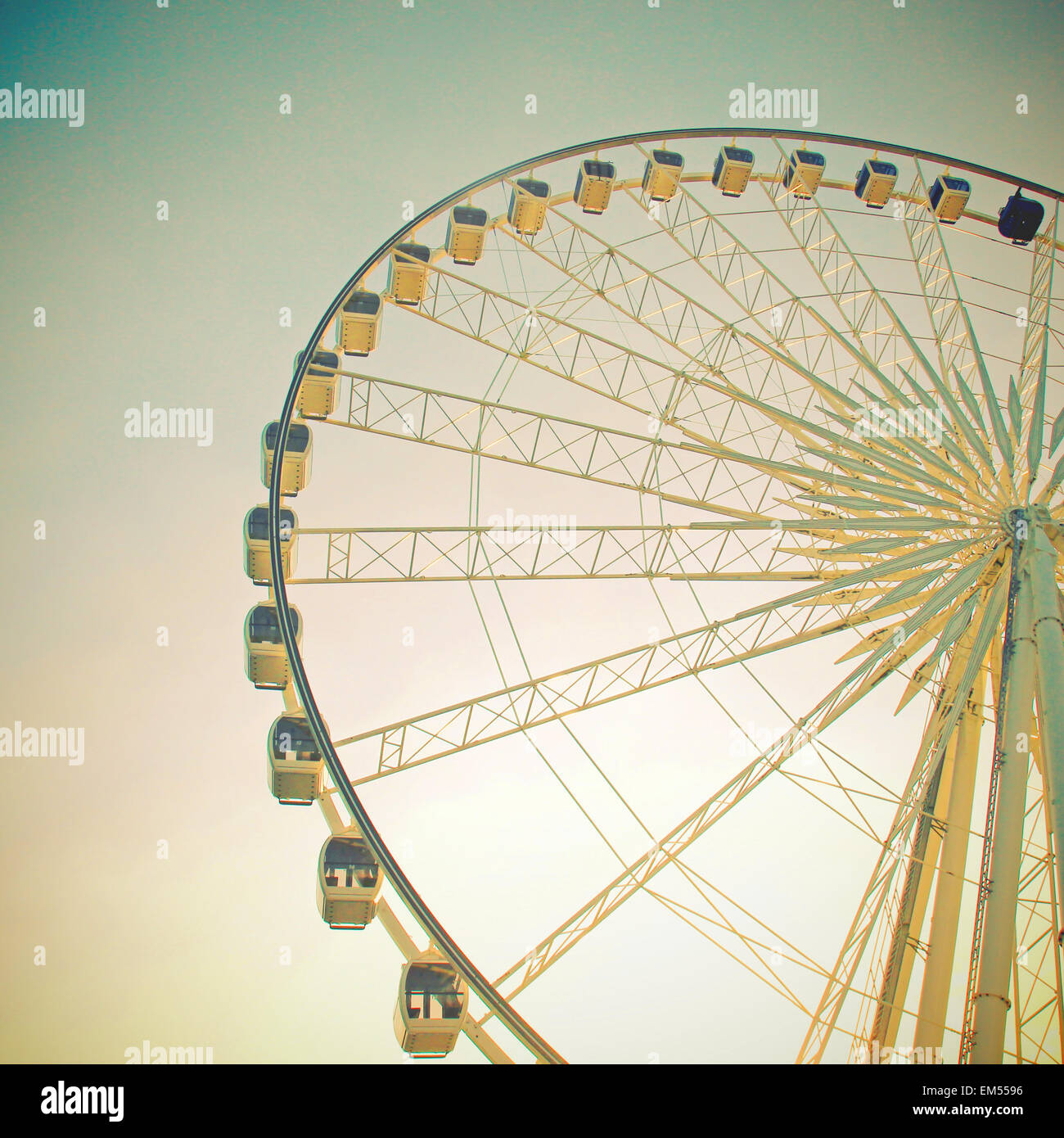 Ferris wheel with blue sky with retro effect Stock Photo - Alamy