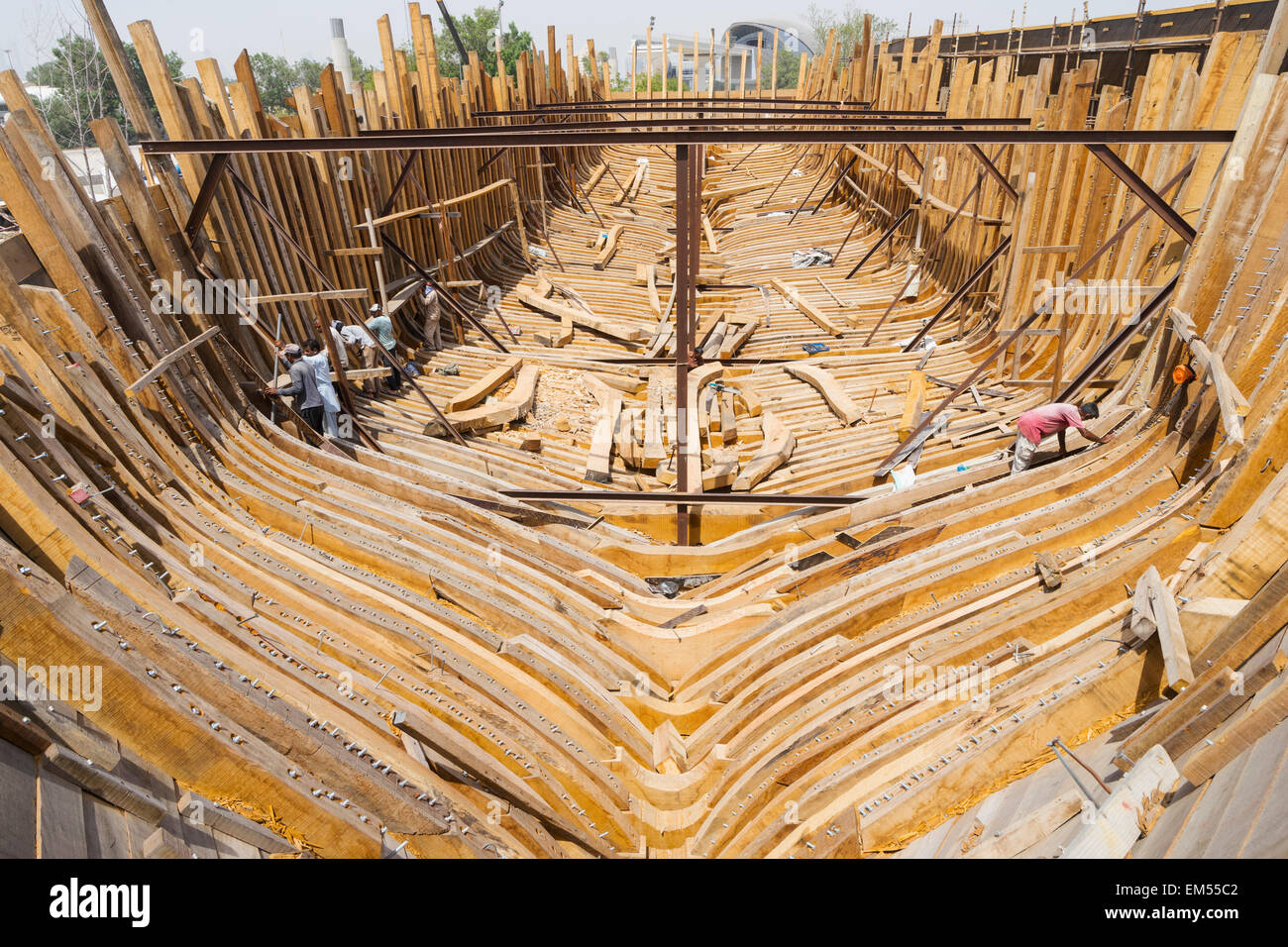 Building a traditional wooden dhow cargo ship in shipyard beside The ...