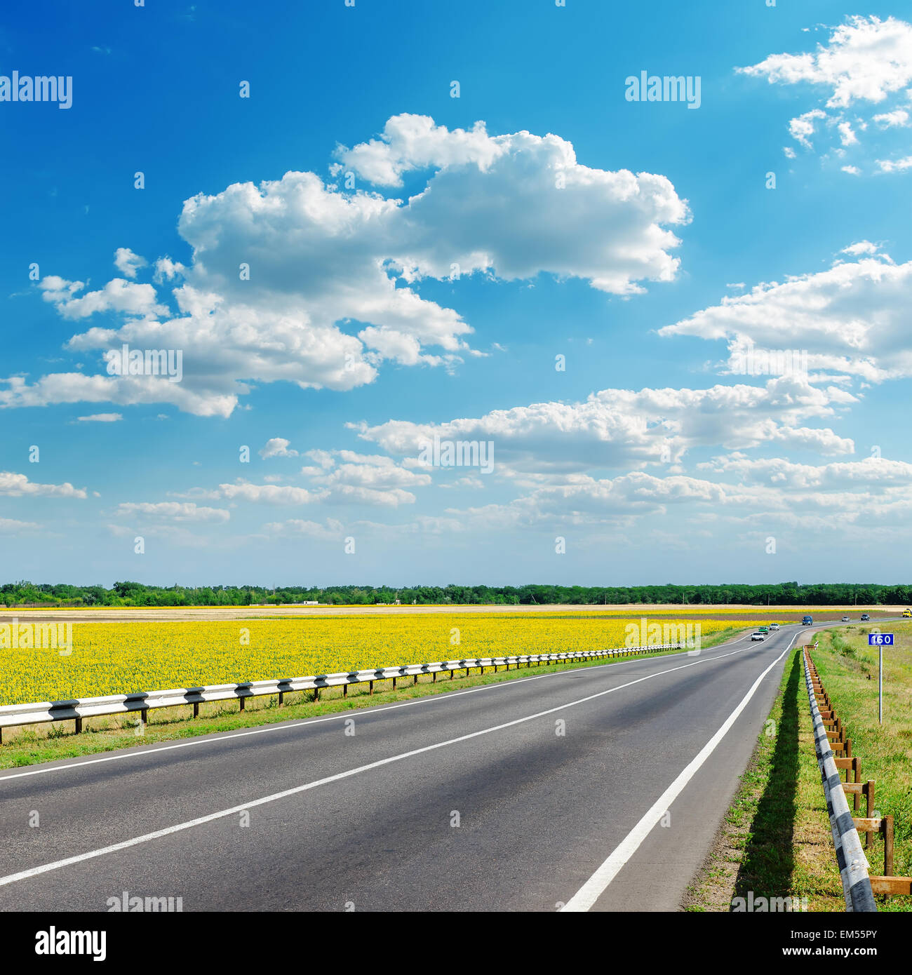 good landscape with asphalt road under clouds on sky Stock Photo - Alamy