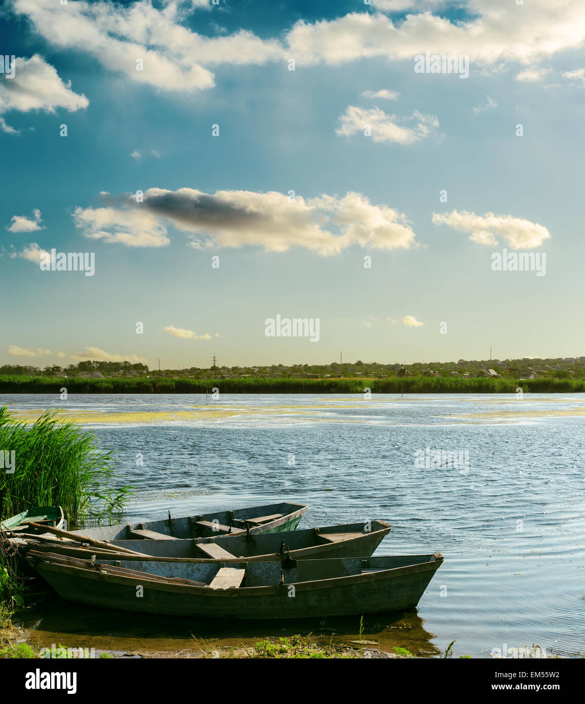 boats on river on sunset Stock Photo - Alamy