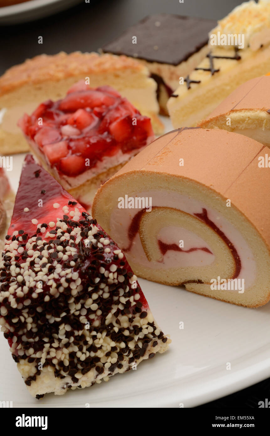 Assortment of delicious cakes on a plate Stock Photo - Alamy