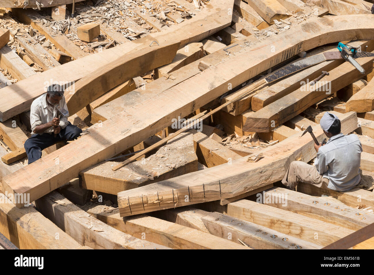 Building a traditional wooden dhow cargo ship in shipyard beside The ...