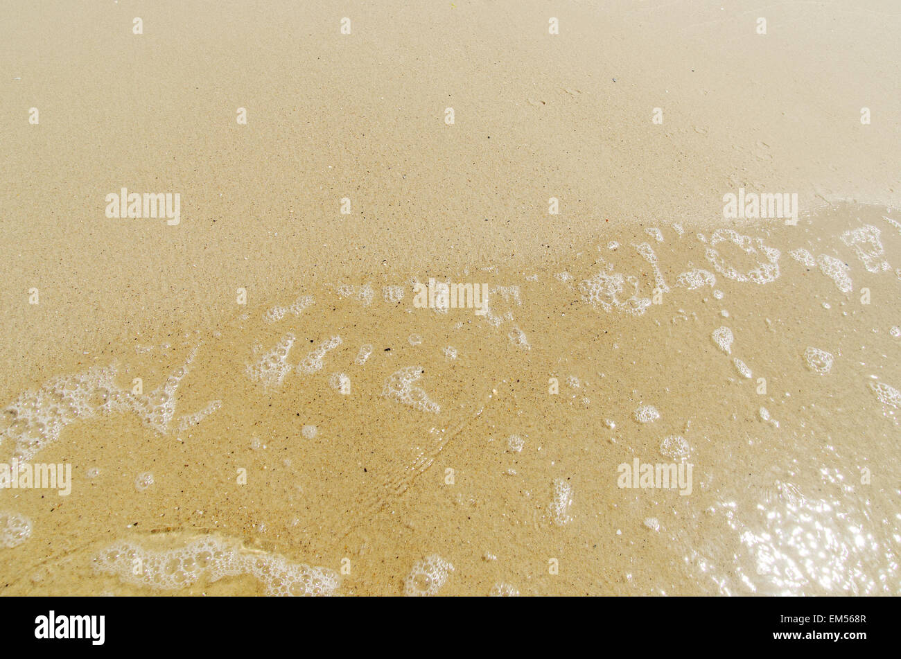 wet sand with water on beach Stock Photo - Alamy