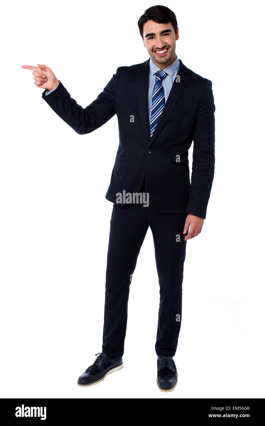 Smart businessman pointing at something Stock Photo - Alamy