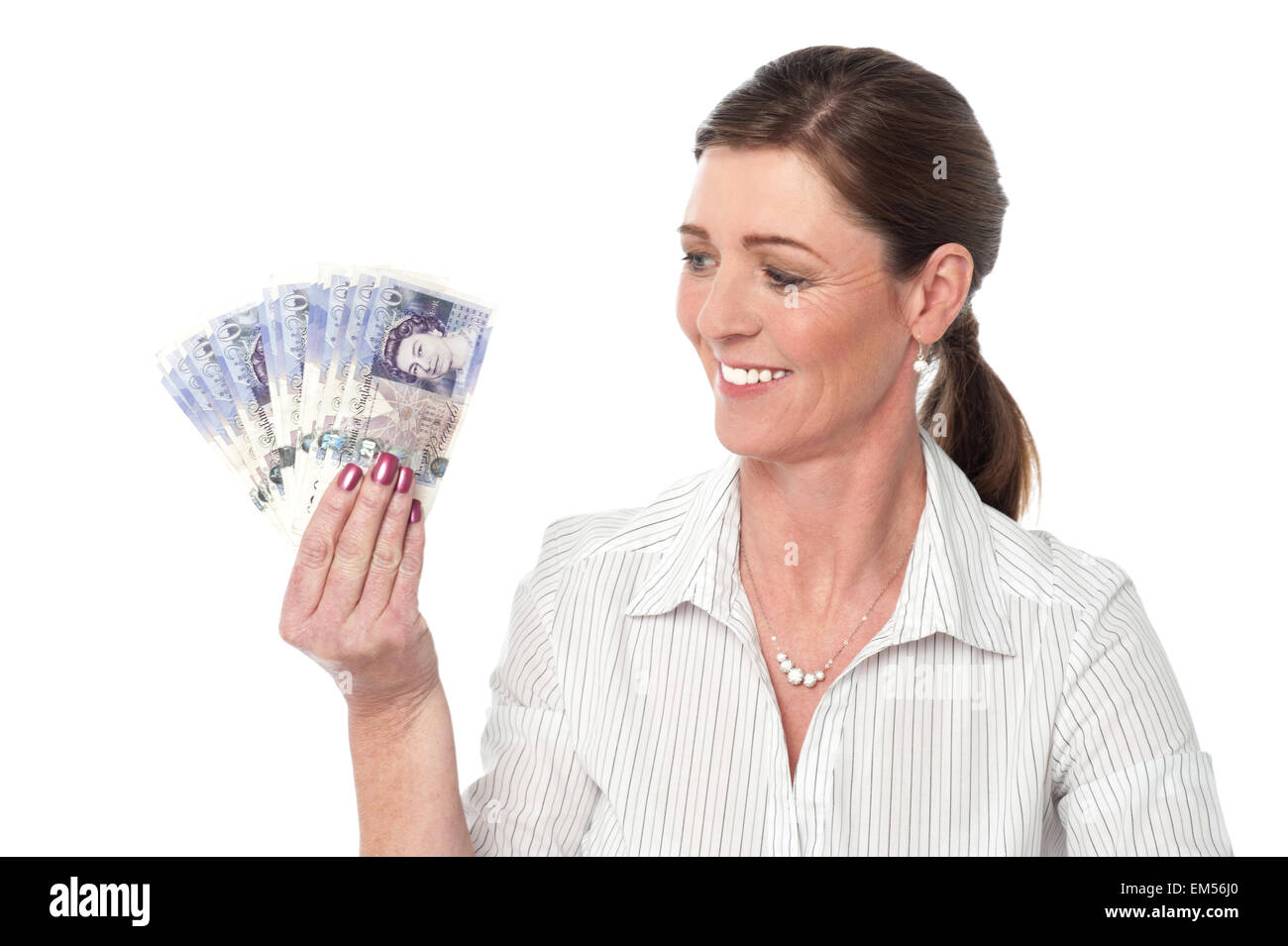 Woman making fan of pound sterling banknotes Stock Photo - Alamy