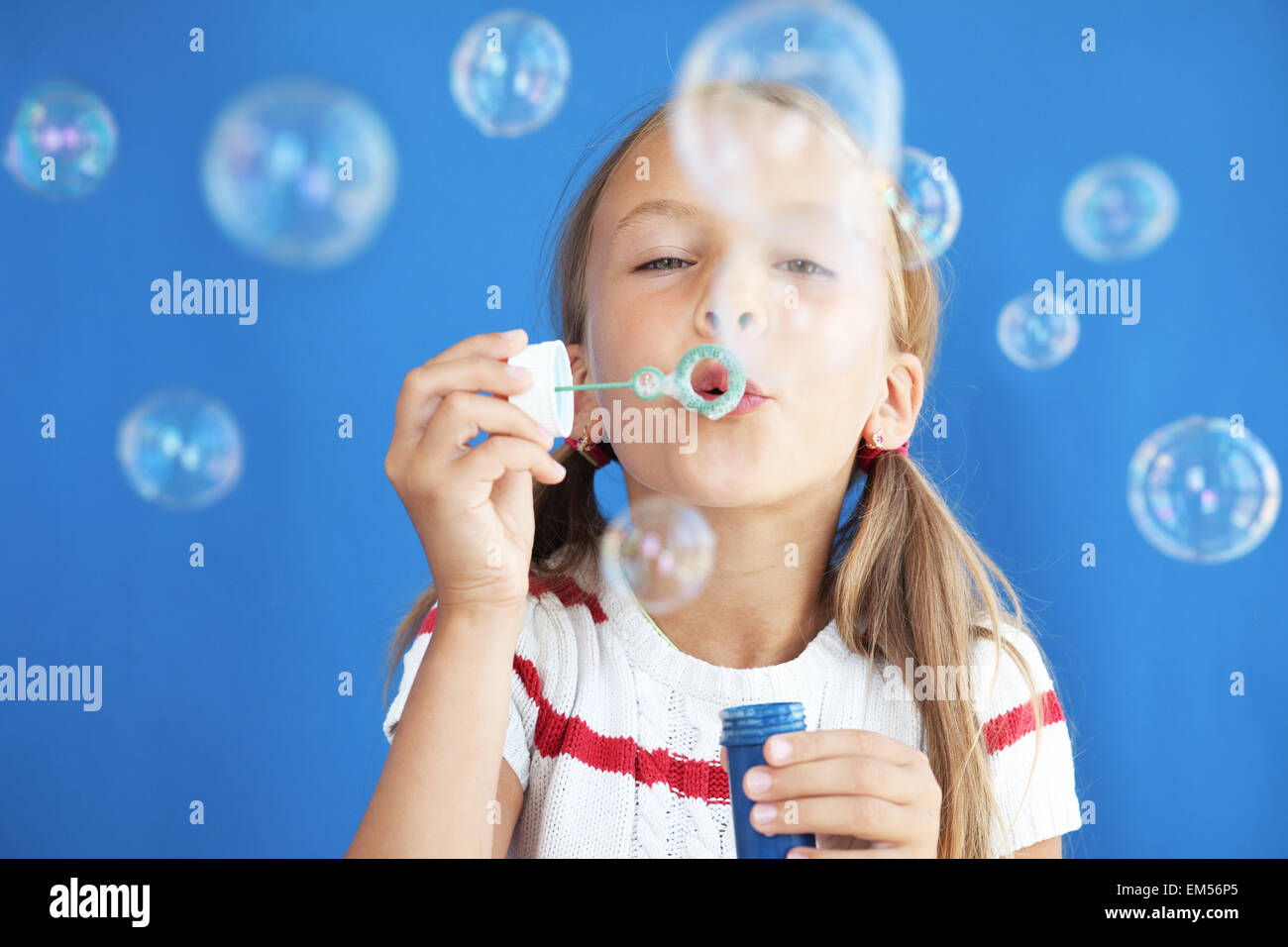 Child blowing soap bubbles Stock Photo - Alamy Child blowing soap bubbles Stock Photo - Alamy