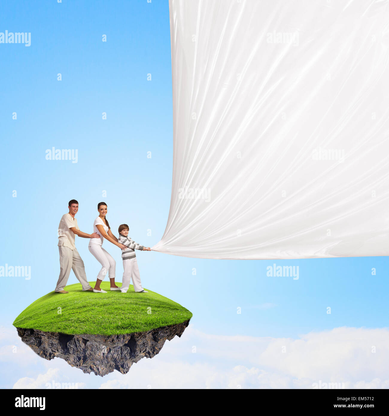 Young family pulling banner Stock Photo - Alamy