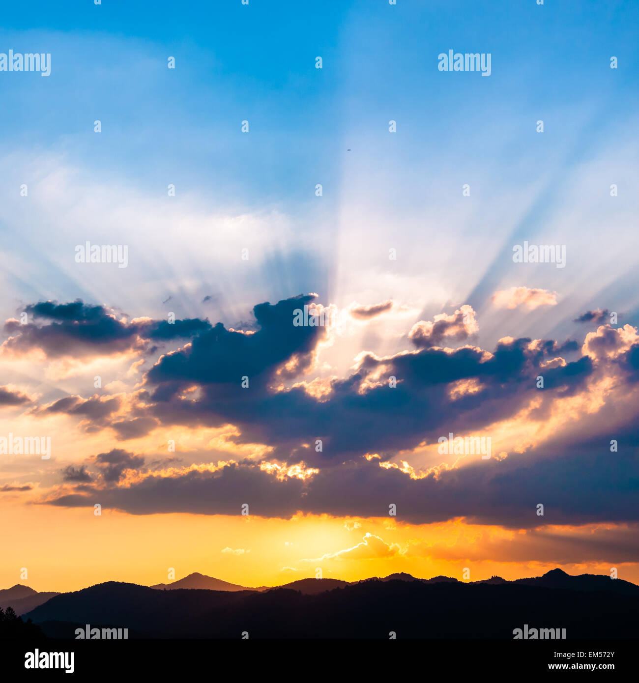 Sunset with sun rays Stock Photo - Alamy