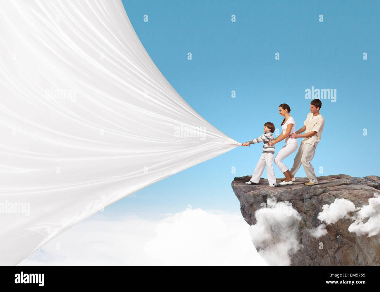 Young family pulling banner Stock Photo - Alamy