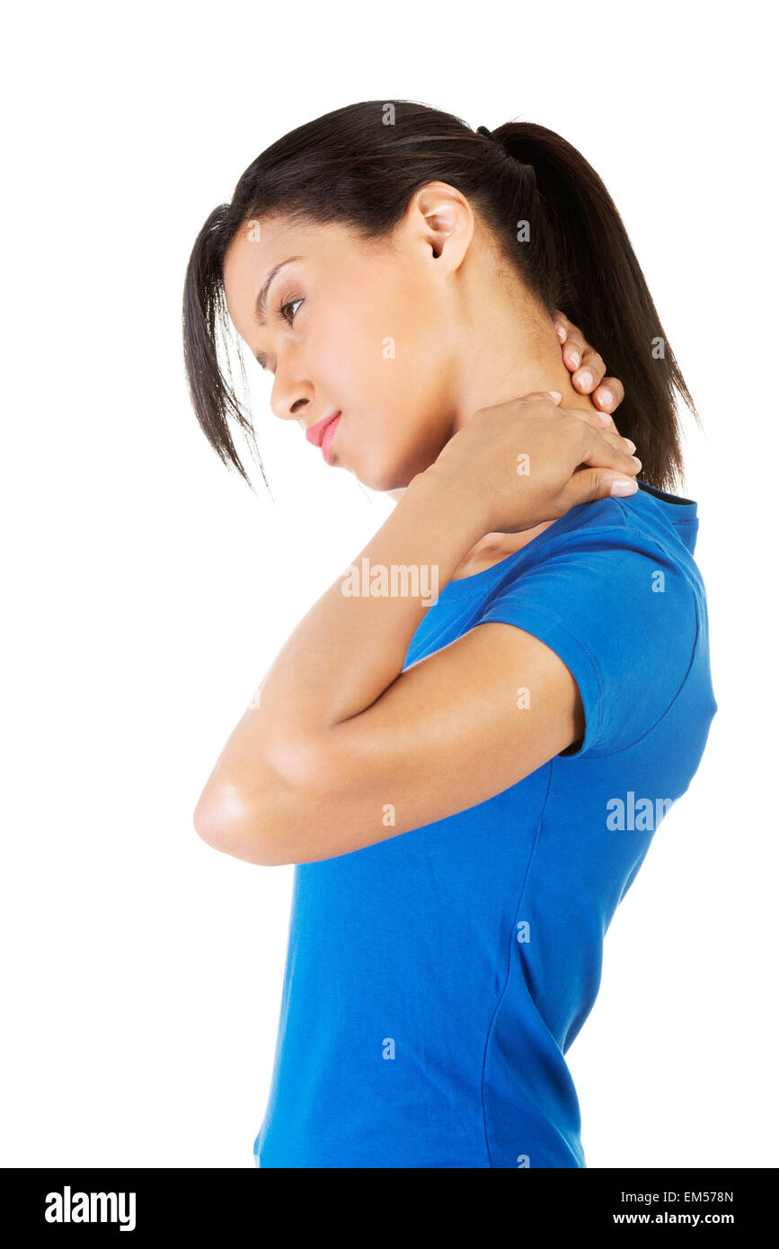 Young woman holding hand on her neck Stock Photo - Alamy