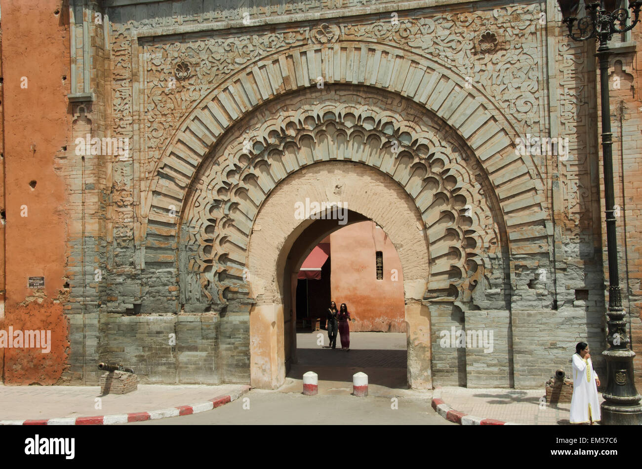 Morocco, Marrakech, Medina, Pedestrians and ornate archway in Medina ...