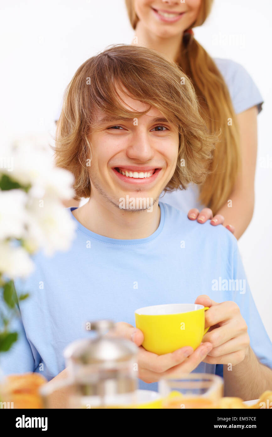 Young happy man drinking tea Stock Photo - Alamy