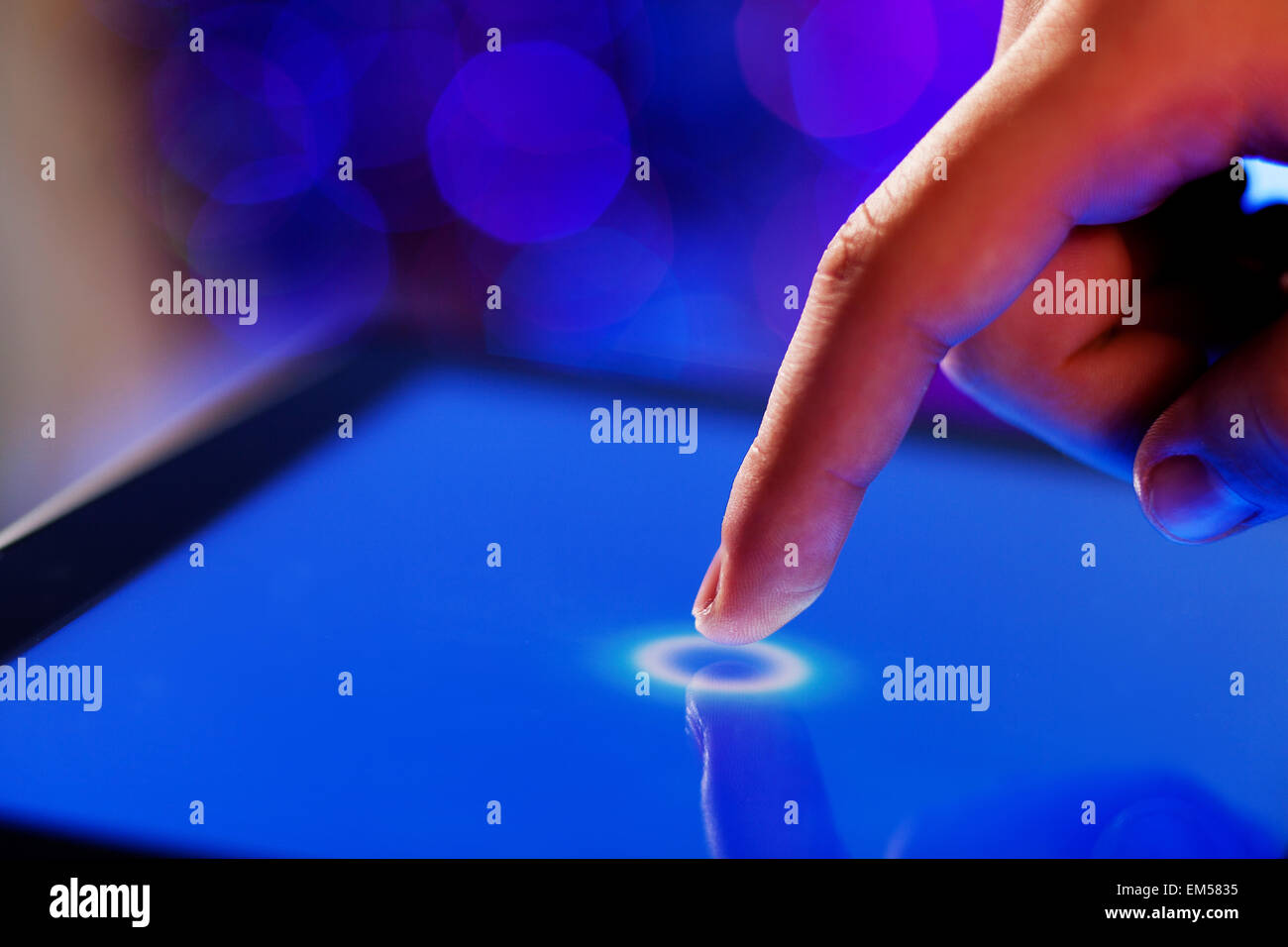 Finger touching screen Stock Photo - Alamy