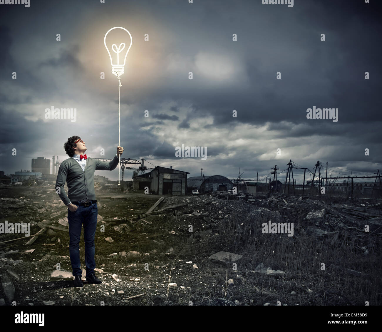 Young man holding a light Stock Photo - Alamy