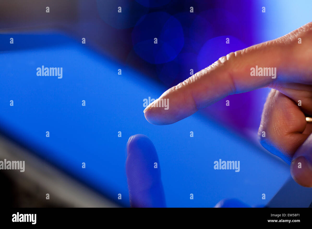 Finger touching screen Stock Photo - Alamy