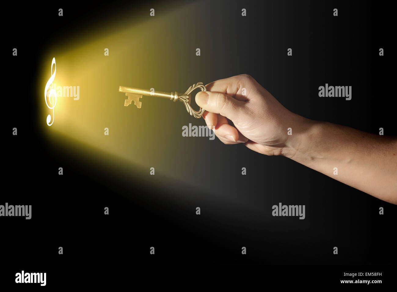 Hand with key Stock Photo - Alamy