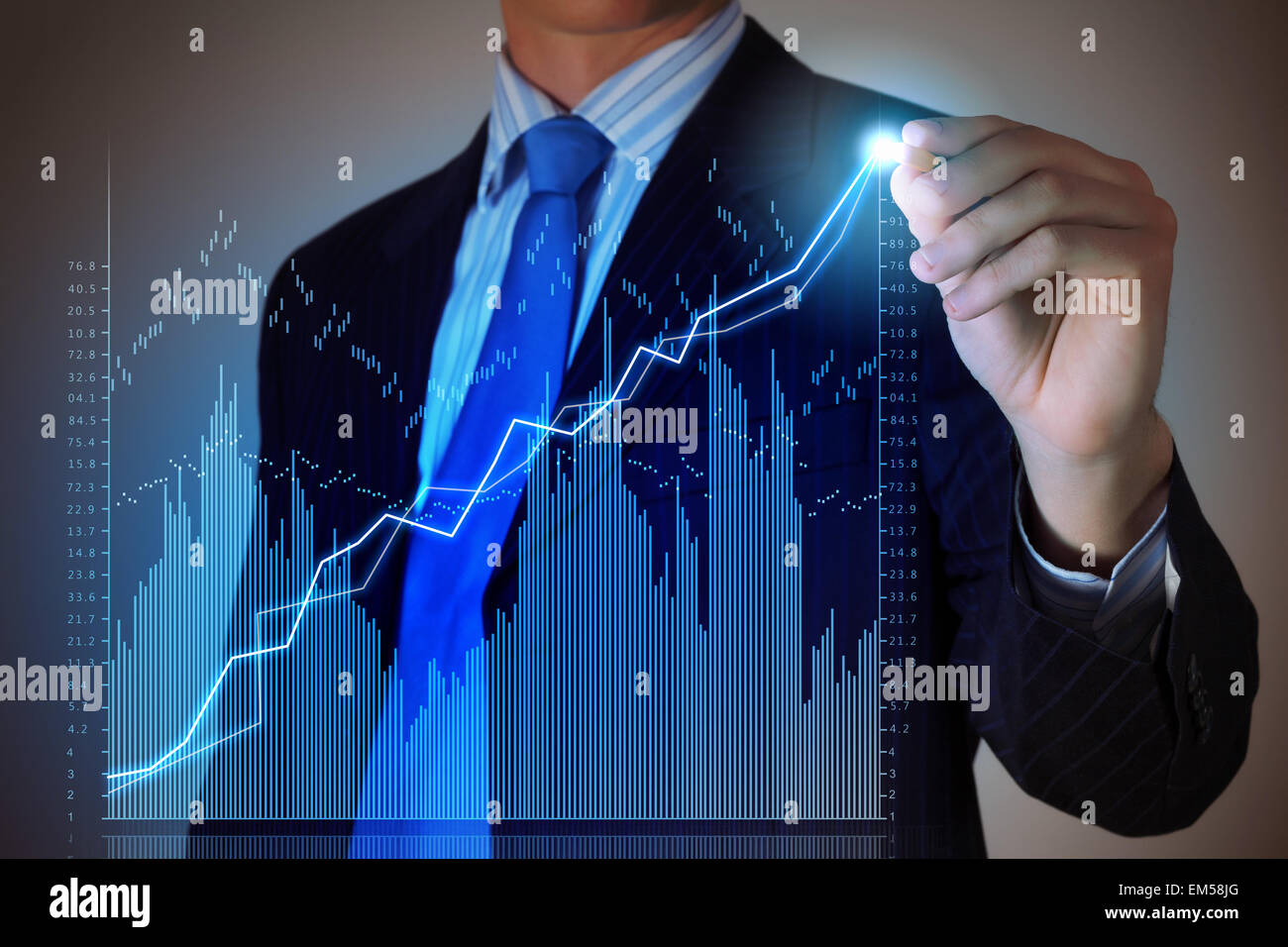 Business man drawing graphics Stock Photo - Alamy