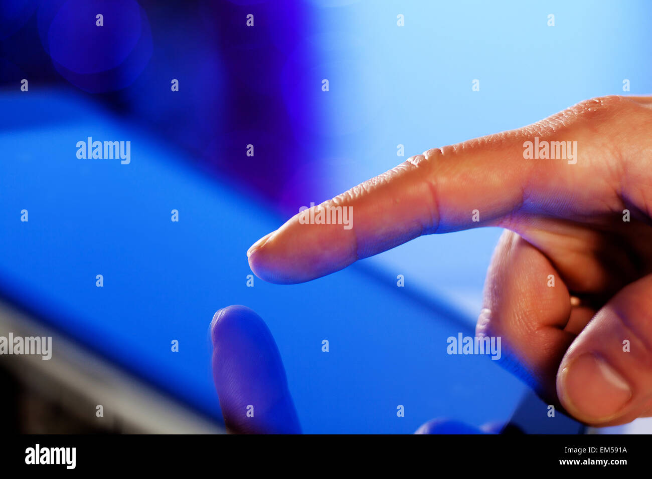 Finger touching screen Stock Photo - Alamy